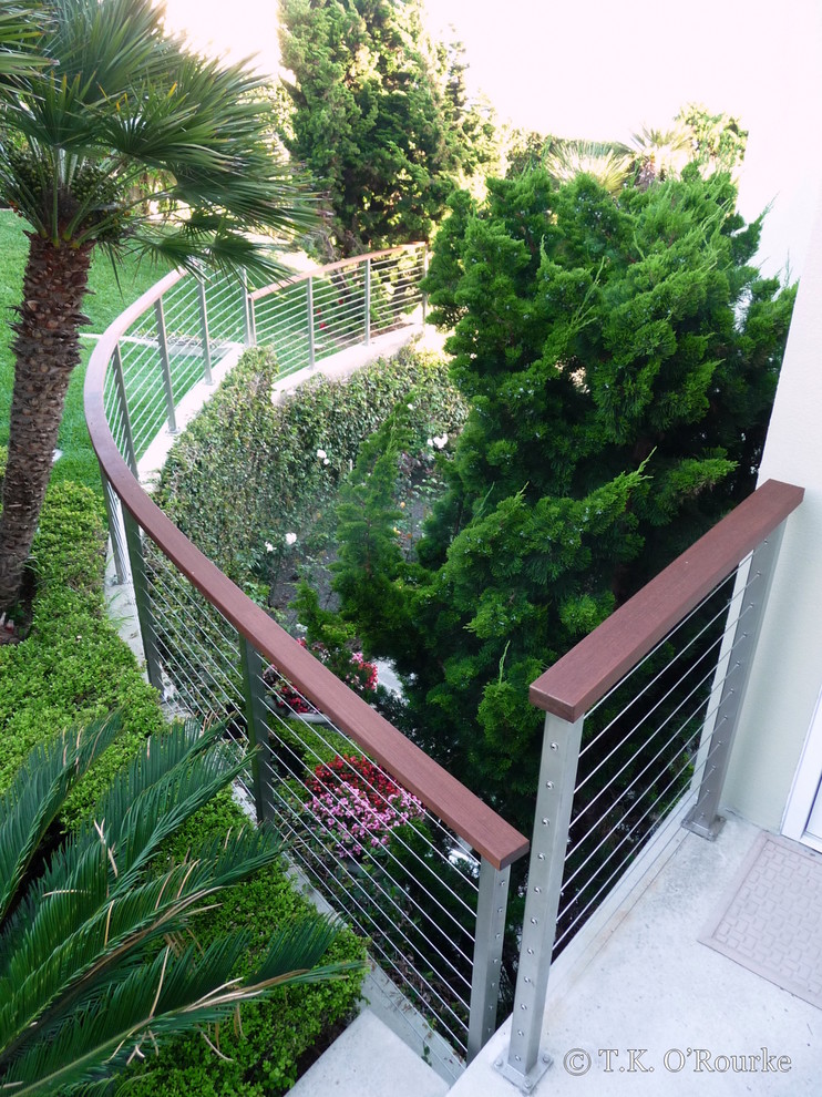 View of Ipe cable railing along sloped walkway - Contemporary ...
