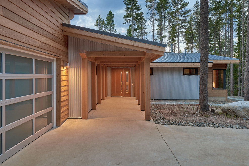 View of the colonnade leading to the front door. - Contemporary ...