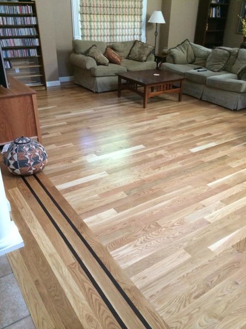White Oak hardwood floor that has a 1″ walnut feature strip ...
