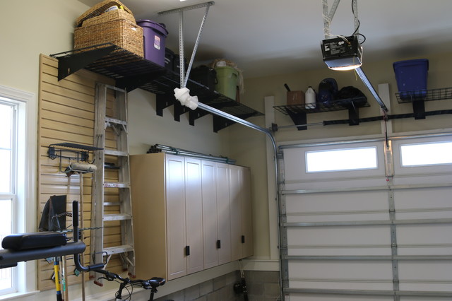 Deep, single wide garage features work bench and exercise area ...