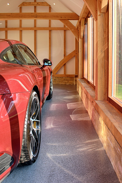 Oak garage with glass wall, creates a light and bright space ...