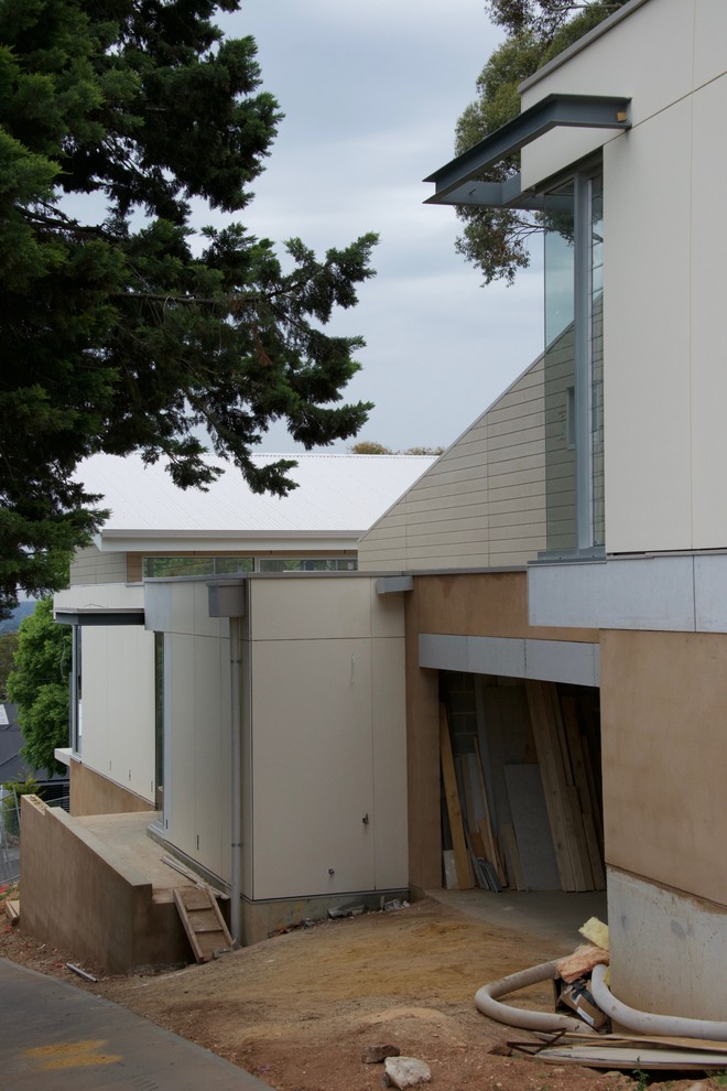 Under construction on a steeply sloping block - Modern - Garage ...