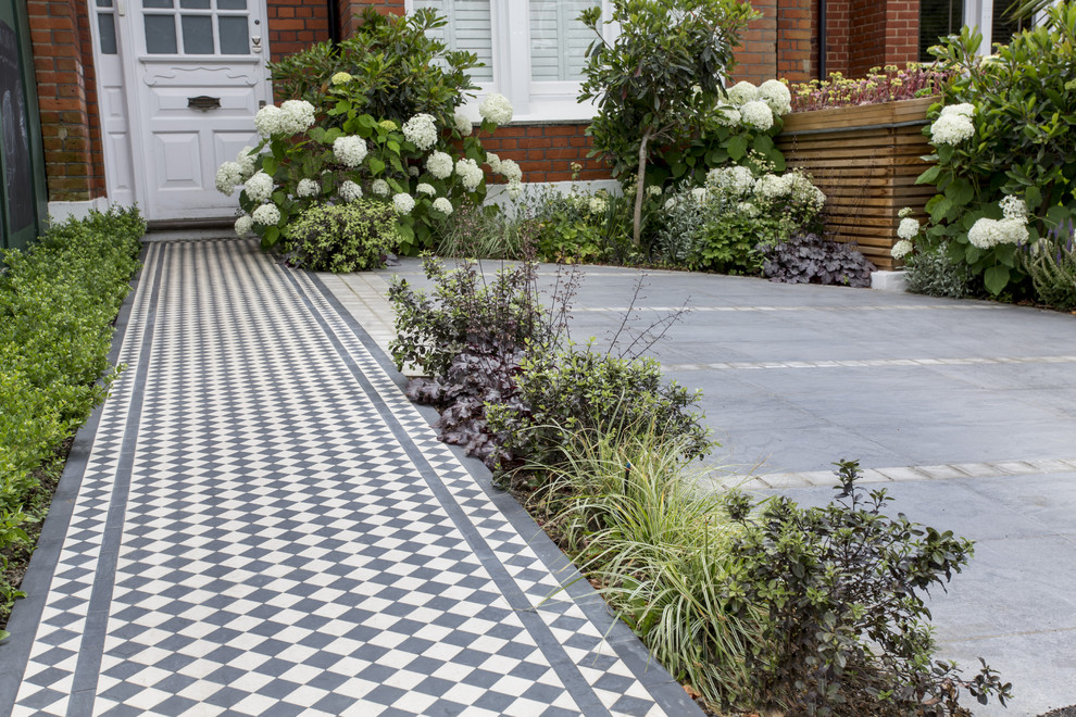 A multi-textured driveway conversion on a slope - Modern - Landscape ...