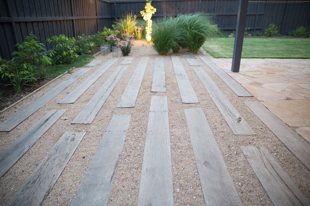 An extension of the patio using ironbark sleepers set in granitic sand ...
