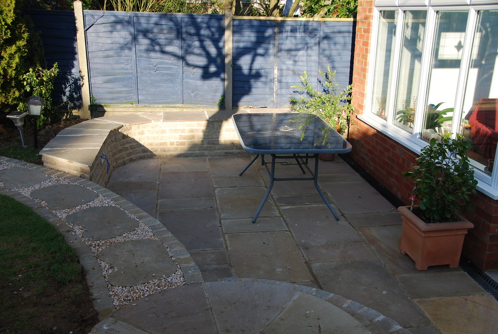 Circular stone steps and seating wall - Traditional - Landscape ...