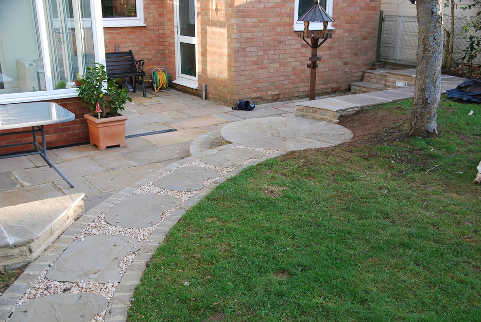 Circular stone steps and seating wall - Traditional - Landscape ...