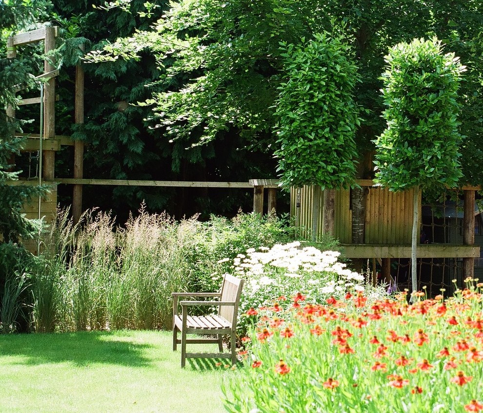 completed scheme featuring tree house and perennial planting. - Modern ...