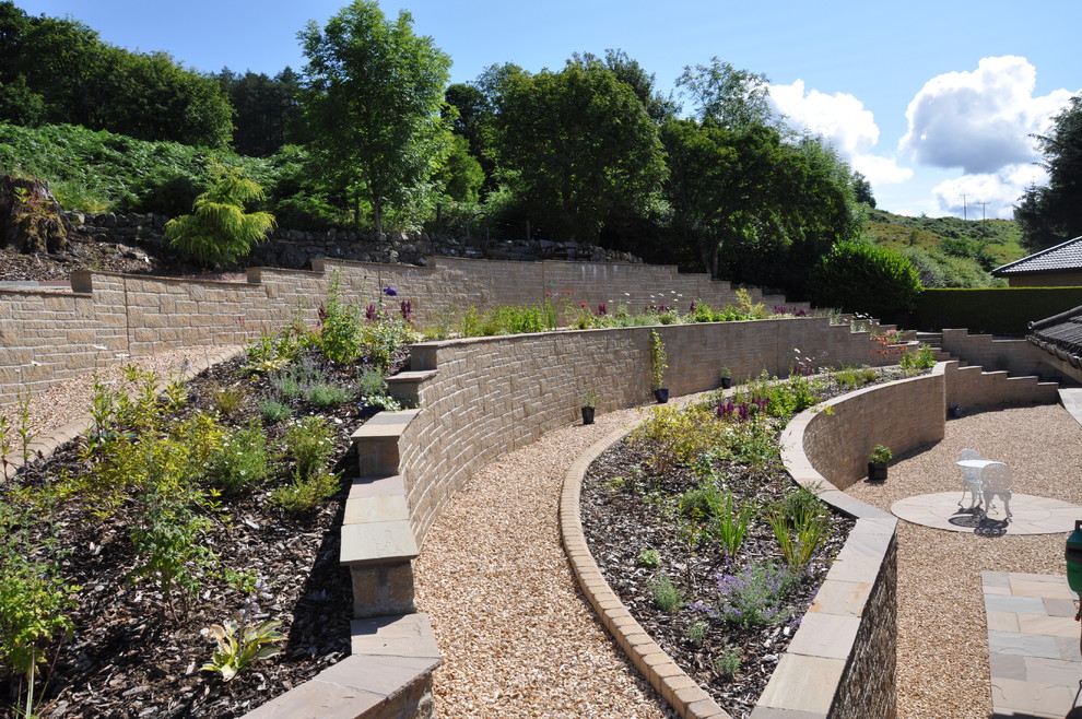 Extensive terracing infilled with bark for specimen planting and gravel ...