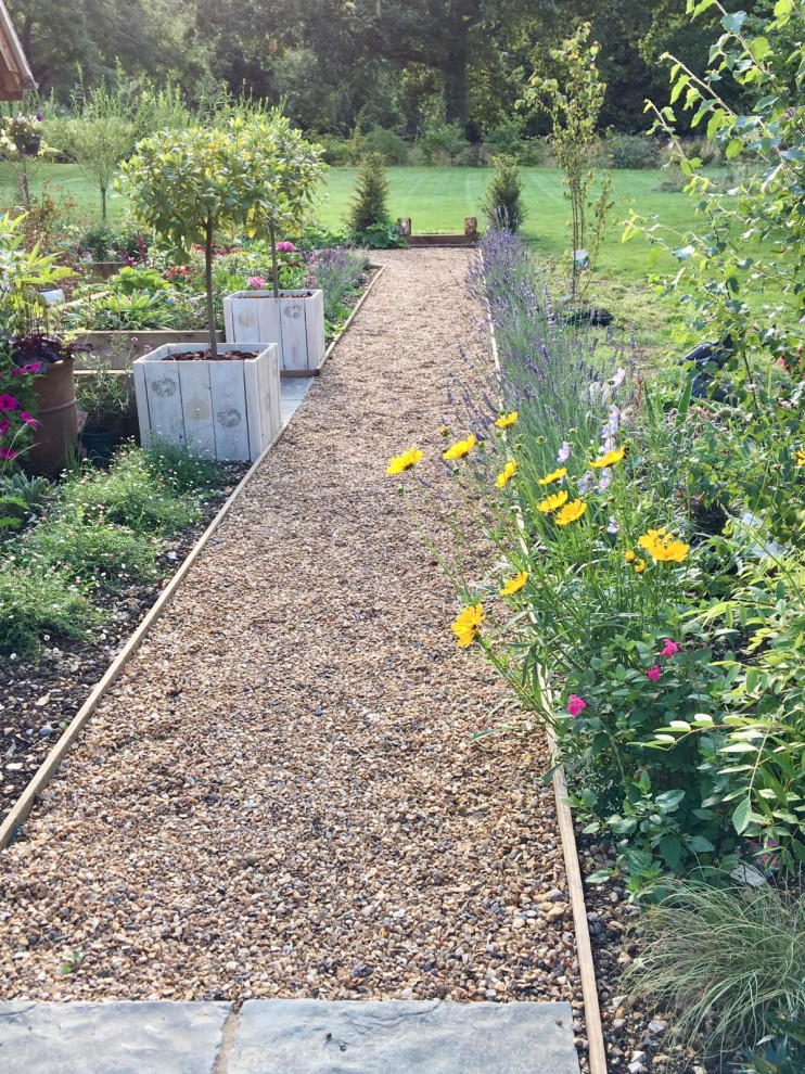 Gravel path guides the eye towards the view beyond - Farmhouse ...