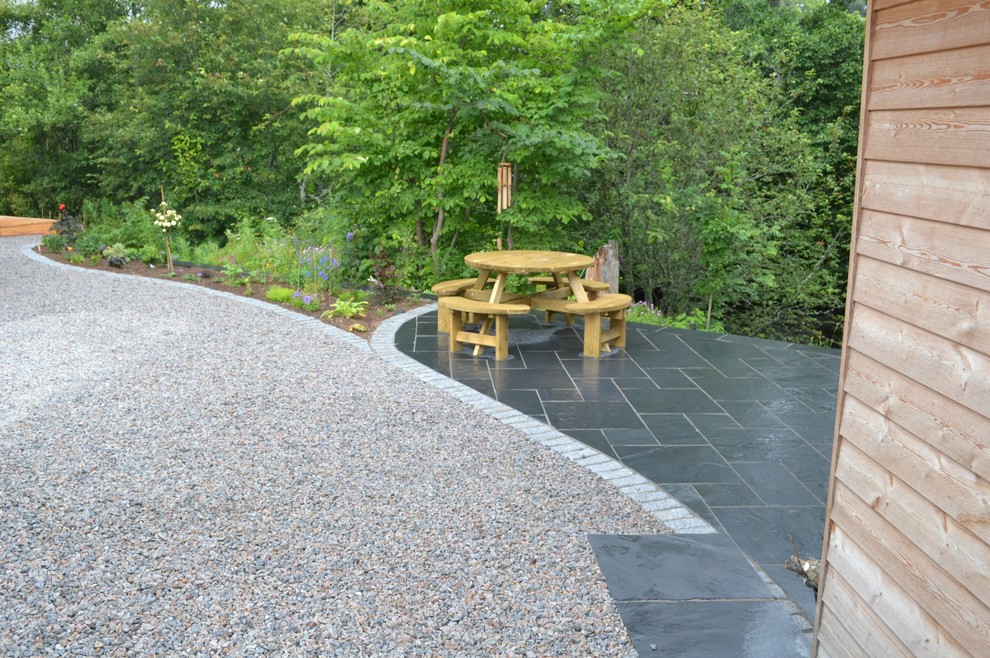 Planting, granite gravel and smart patio transforms this garden ...