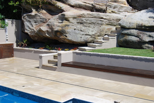 Pool surrounds with Haddenstone pavers, timber bench seating with ...