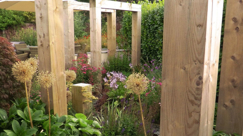 Posts & Perennials - Oak arches and Alliums. - Contemporary - Landscape ...