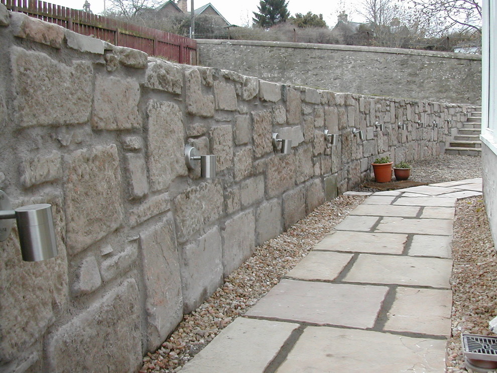 Stone wall with sandstone path and quartz gravel border - Traditional ...