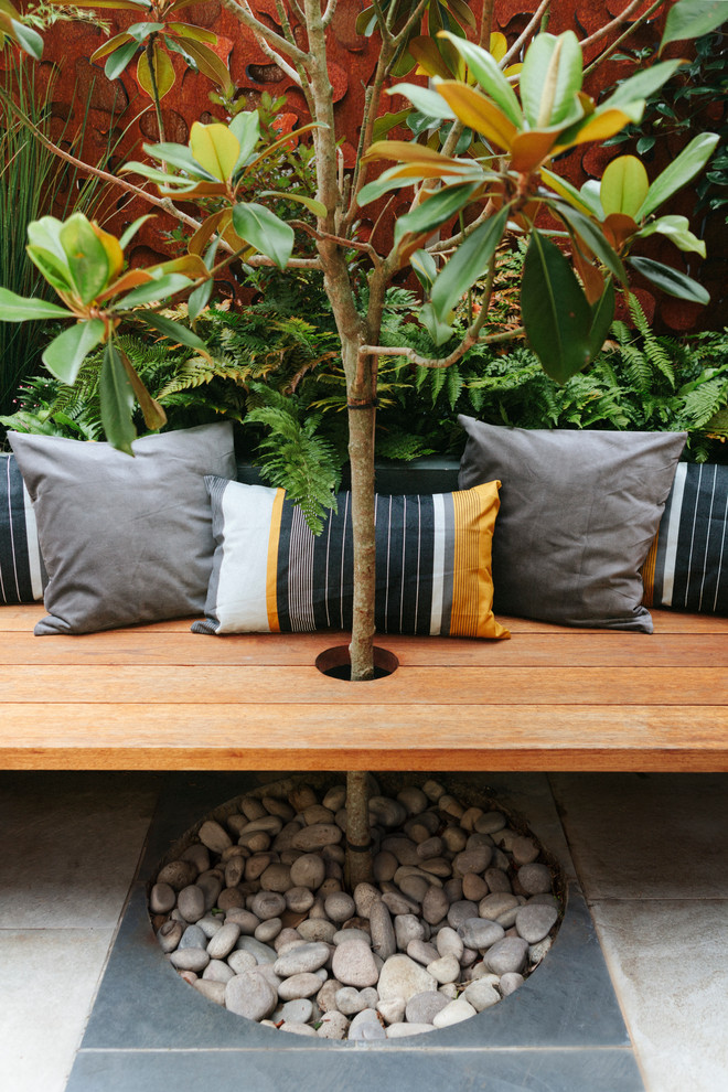 The Scottish pebbles echo the circular cut out for the tree - Landscape ...