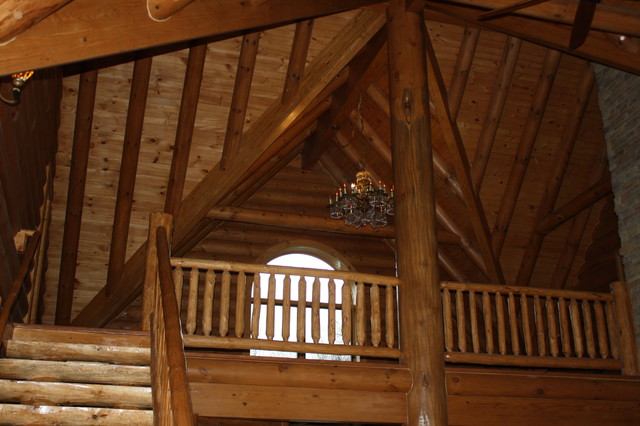 Loft Sitting Area with Heavy Timber Rafters and Beams - Rustic ...