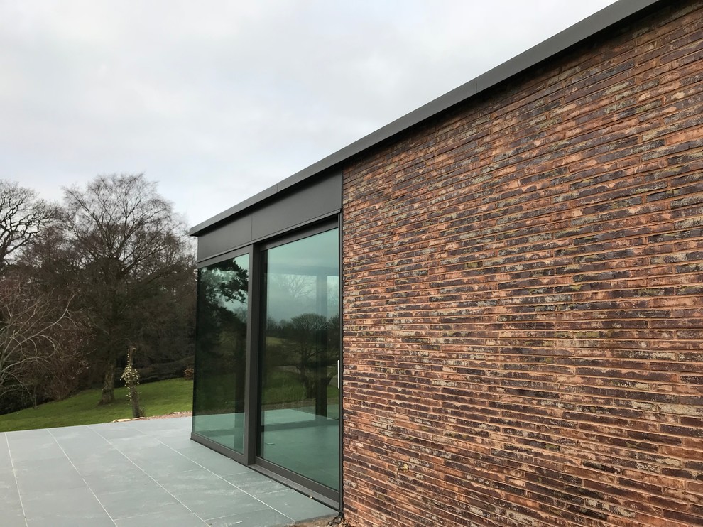 Contemporary glass to glass corner window with sliding doors ...