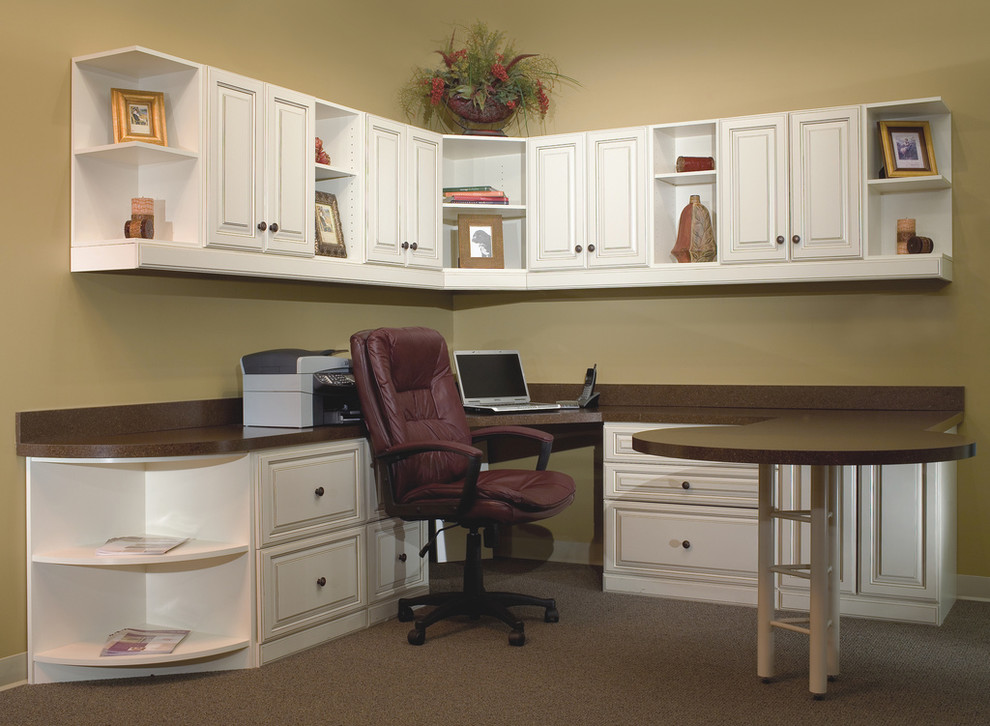 Home office with extended round table and lots of storage and wall ...