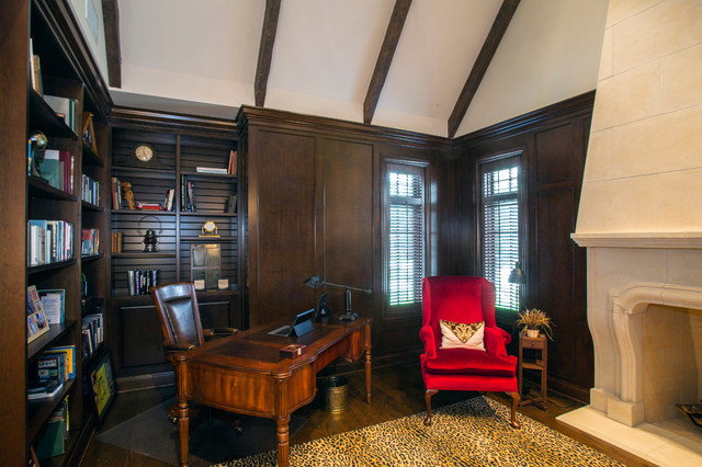 Knotty cherry home office with limestone fireplace and freestanding ...