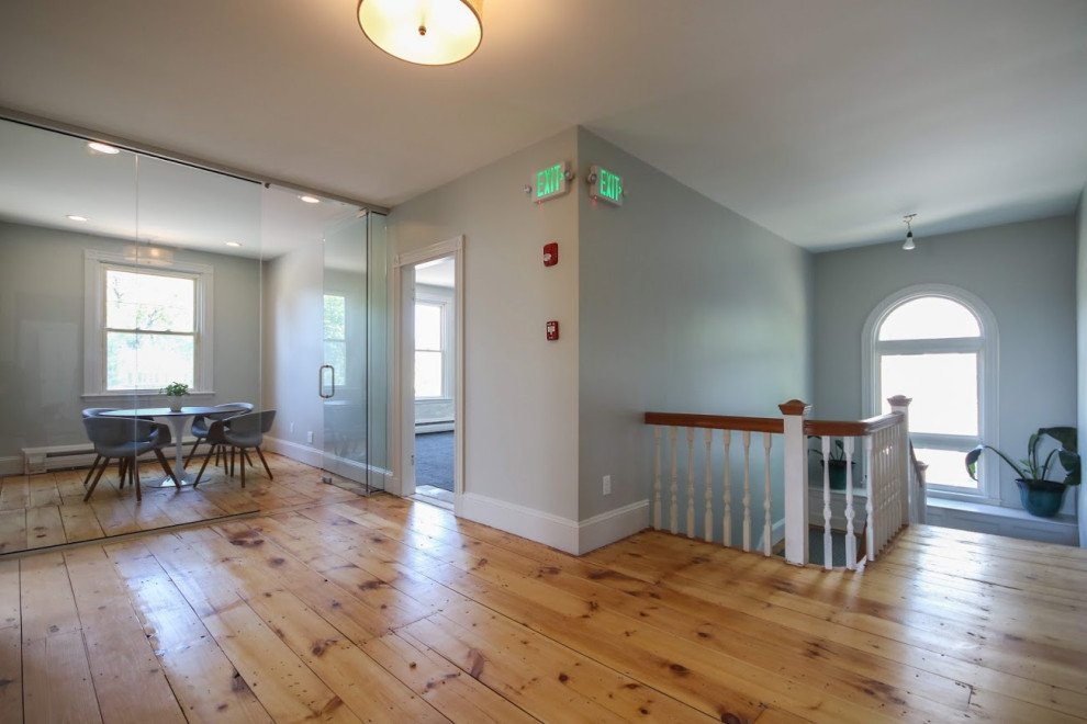 Small conference room with glass wall, refinished wood floors - Home ...