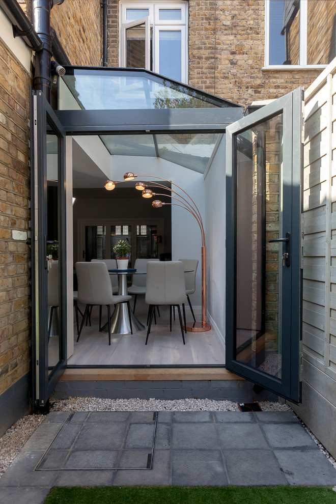Modern glazed extension with open pitched roof and skylight - Modern ...