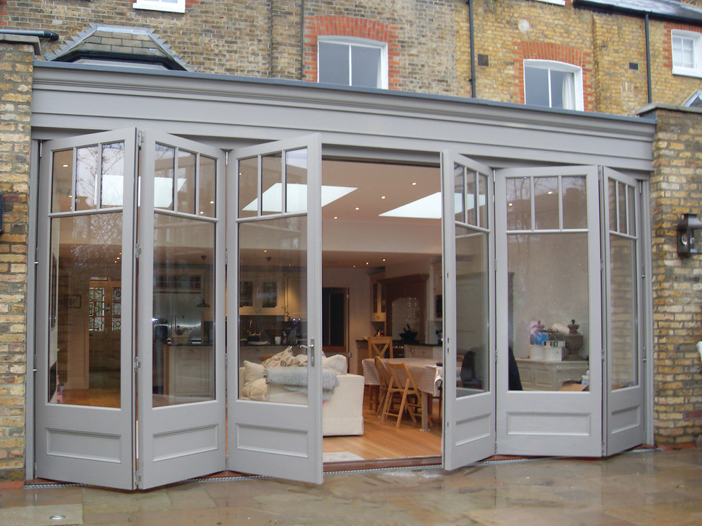 Sliding folding doors with a panel base design and fascia above ...