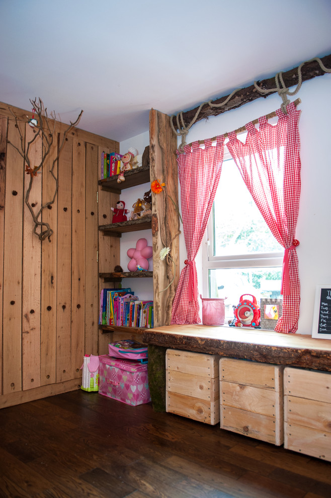 indoor forest cottage playroom with giant blackboard and rustic storage ...