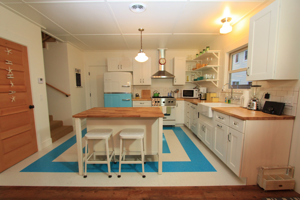 A California Cabin featuring a Beach Cruiser Retro Fridge and a white ...