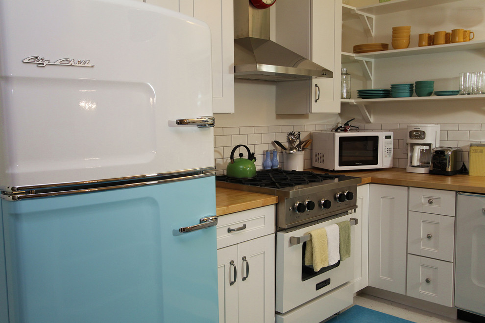 A California Cabin featuring a Beach Cruiser Retro Fridge and a white ...