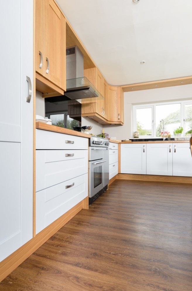A combination of a shaker style kitchen with warm oak and soft painted ...