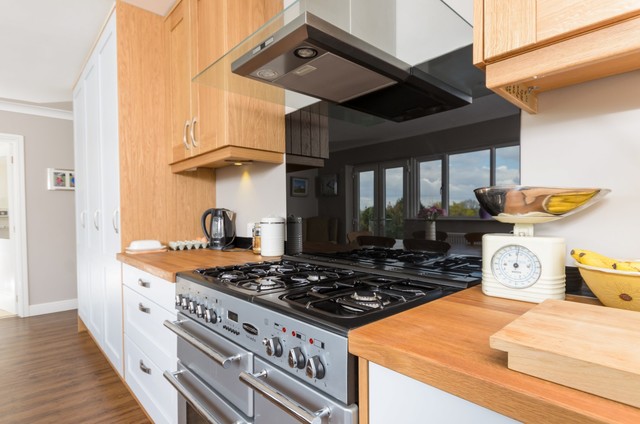 A combination of a shaker style kitchen with warm oak and soft painted ...