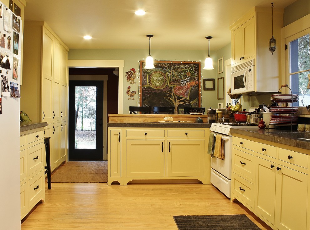 A Russian Fireplace Anchors a 1912 Family Home - Farmhouse - Kitchen ...