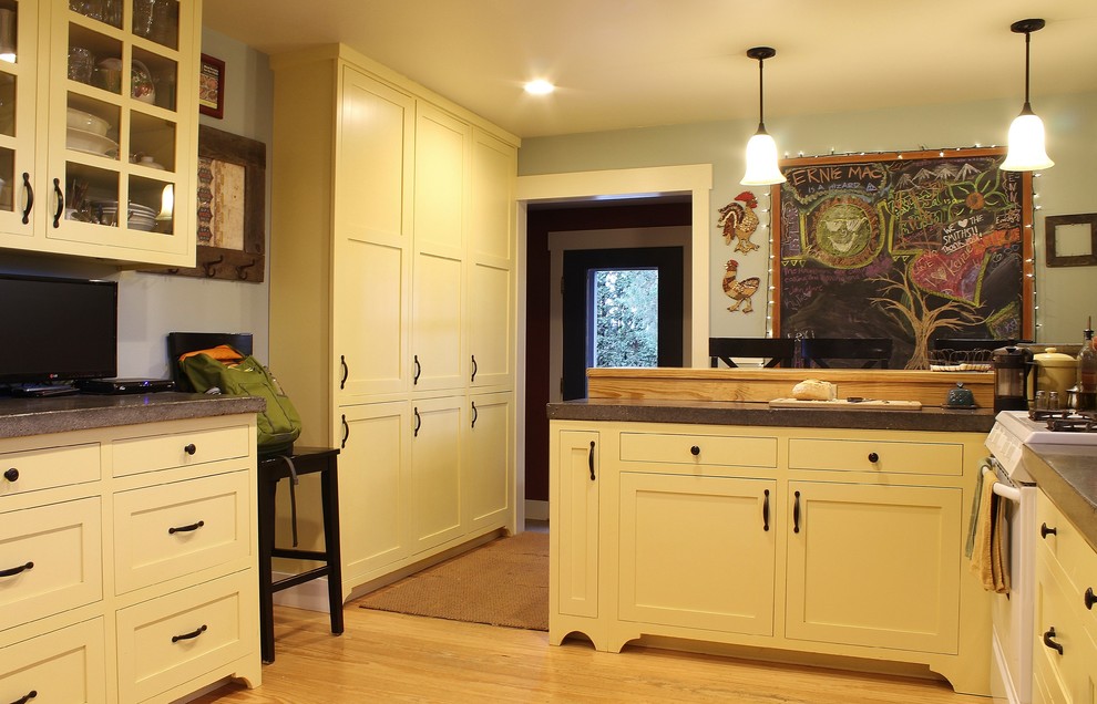 A Russian Fireplace Anchors a 1912 Family Home - Farmhouse - Kitchen ...