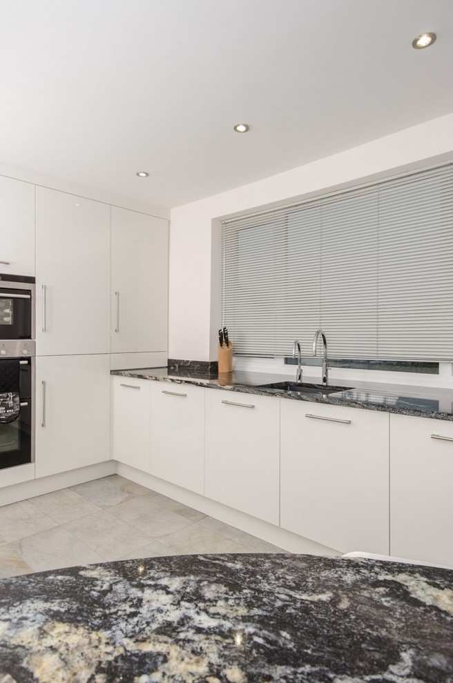 A striking monochrome design creates a contemporary kitchen for ...