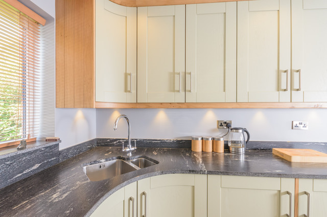 A touch of theatre for a traditional kitchen with sweeping curves and ...