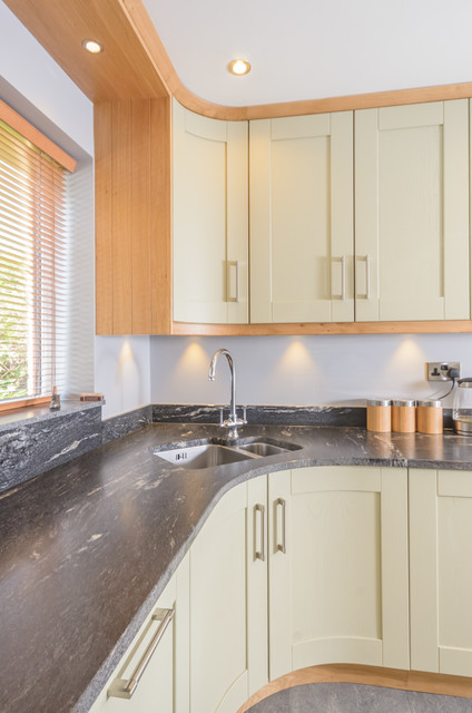 A touch of theatre for a traditional kitchen with sweeping curves and ...