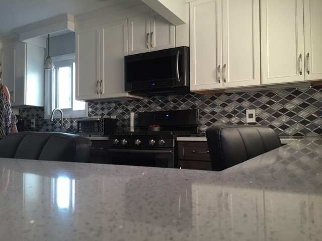 Black and White Kitchen with Stainless Steel Backsplash - Contemporary ...