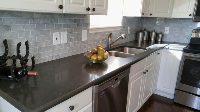 Caesarstone Piatra Grey Quartz Countertop with Carrara Marble Subway ...