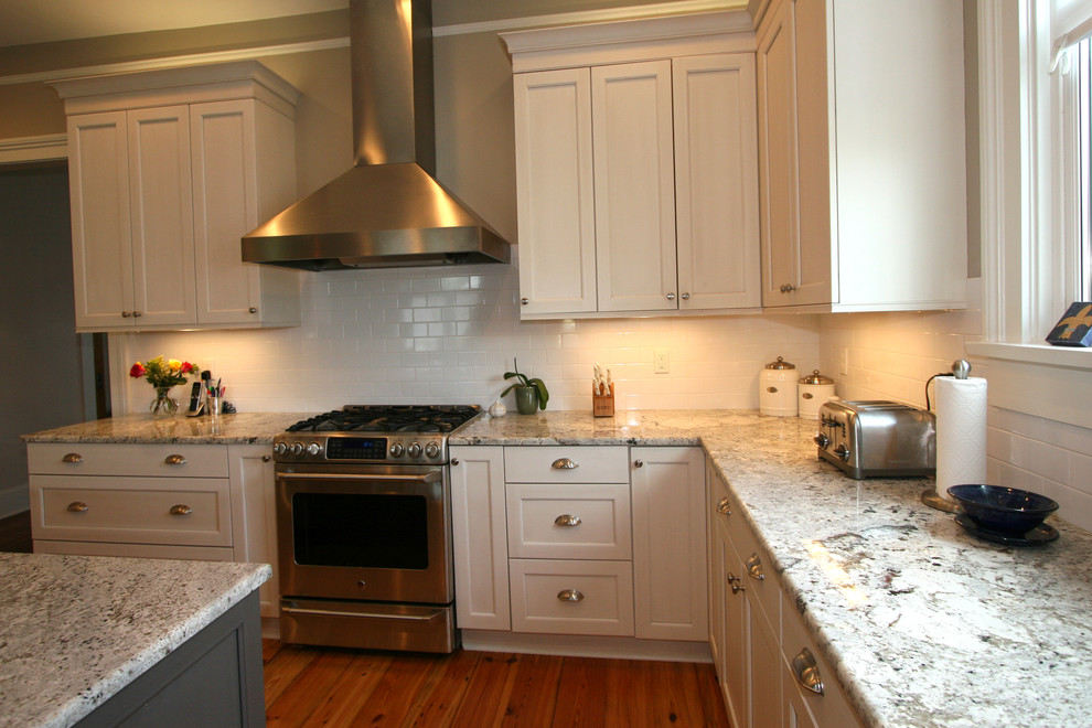 Classically Inspired Kitchen with Stainless Chimney Hood and Pantry ...