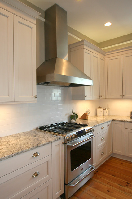 Classically Inspired Kitchen with Stainless Chimney Hood and Pantry ...