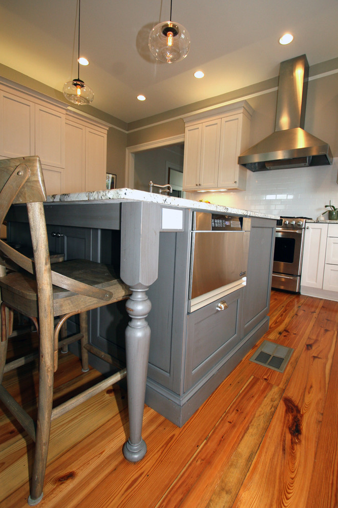Classically Inspired Kitchen with Stainless Chimney Hood and Pantry ...