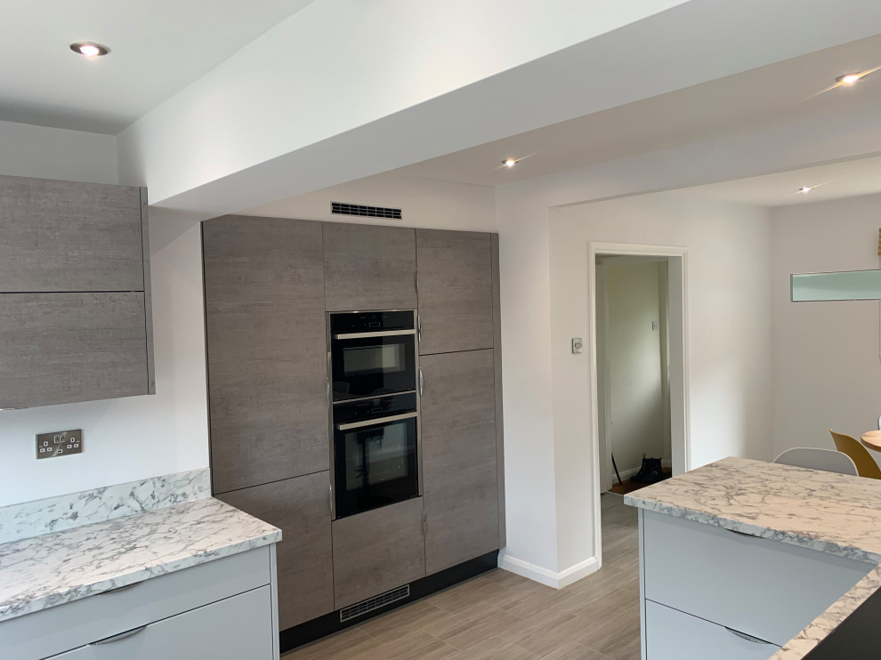 Concrete scribed tall units with single oven and combi oven - Modern ...