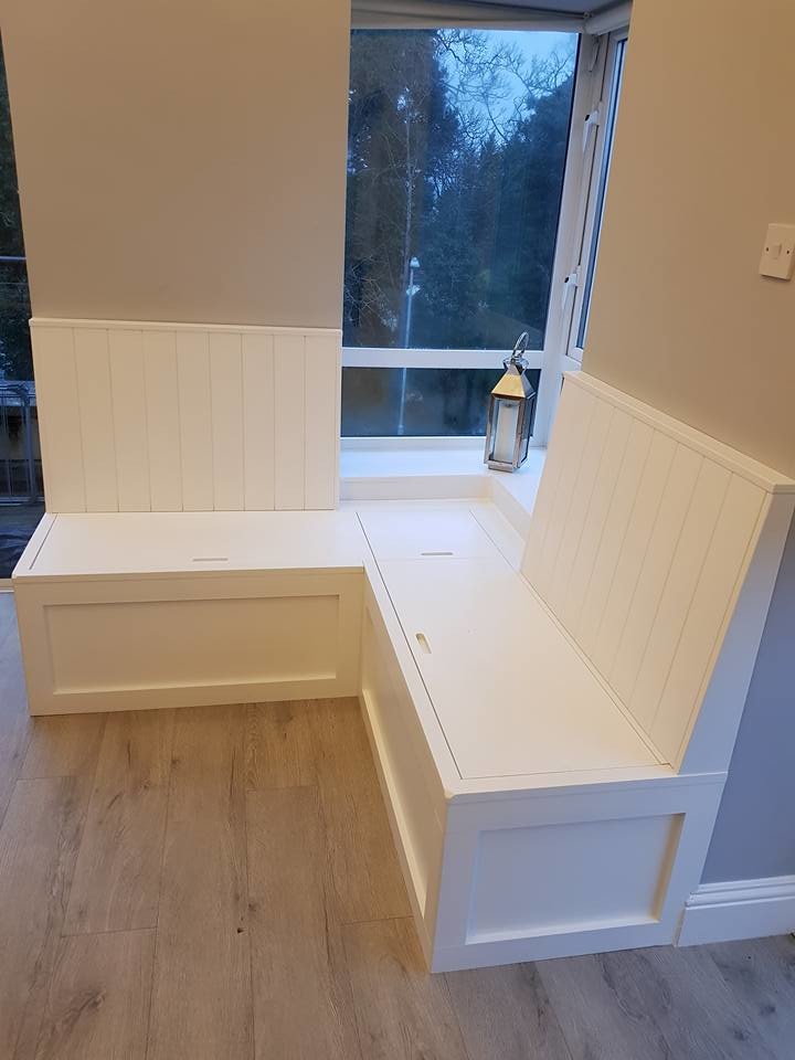 Corner seating booth with storage and extendable pedestal table ...