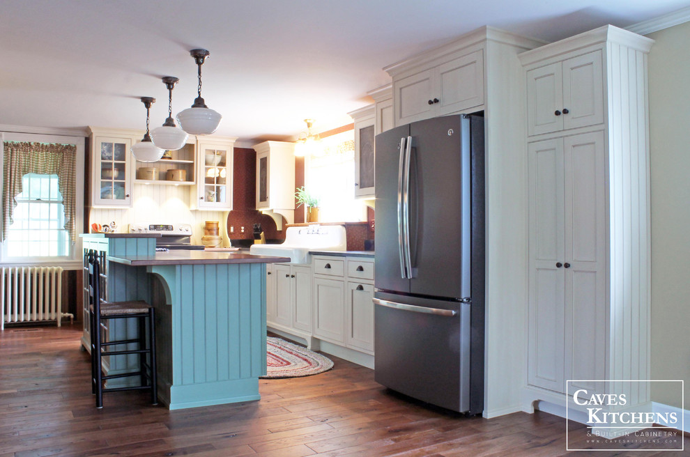 Cream Farmhouse Kitchen with Green Island & Paneled Dishwasher ...