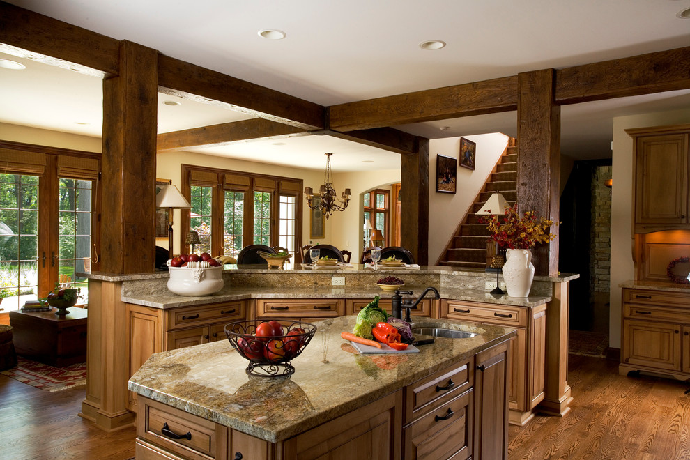 Curved peninsula with large timber beams separate the kitchen from the ...