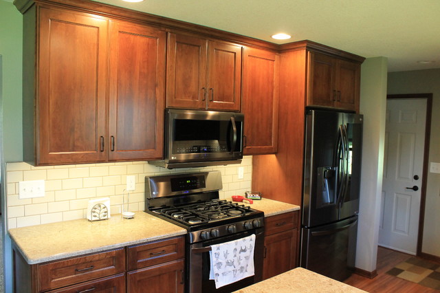 Dynasty by Omega Cabinetry. Wyatt door, Cherry wood, Nutmeg stain, Onyx ...