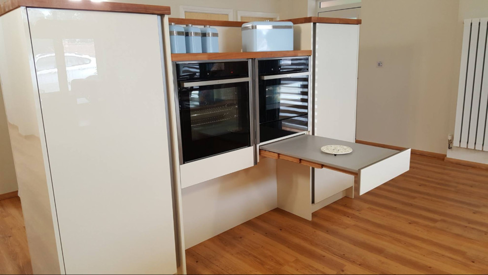 Easy Access Kitchen with Motorised Multi Level Island - Contemporary - Kitchen - Other - by ...