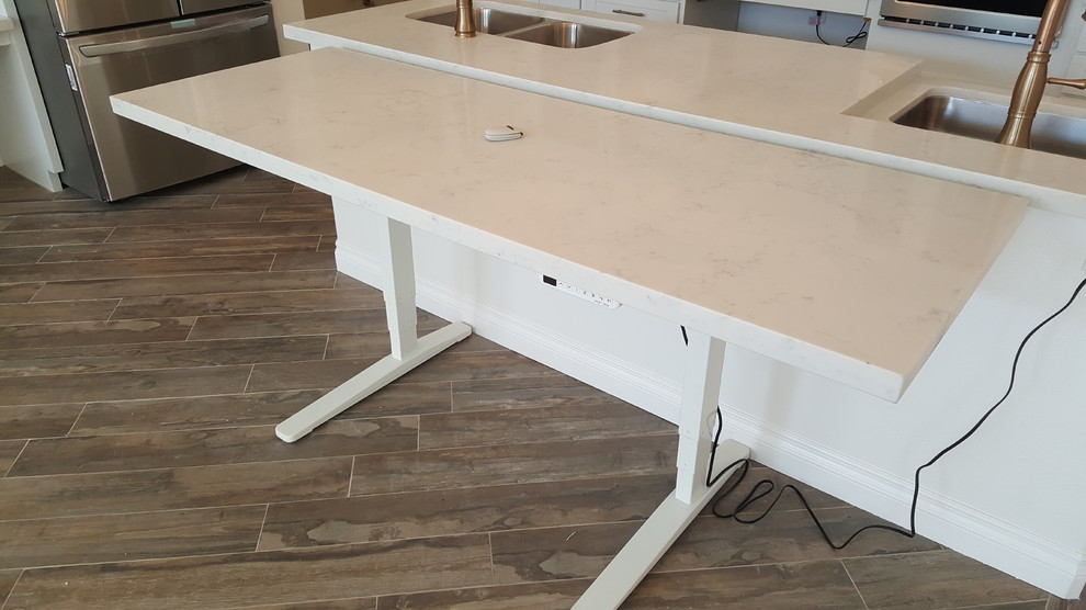 Electric, adjustable height table provides easy access for baking and ...