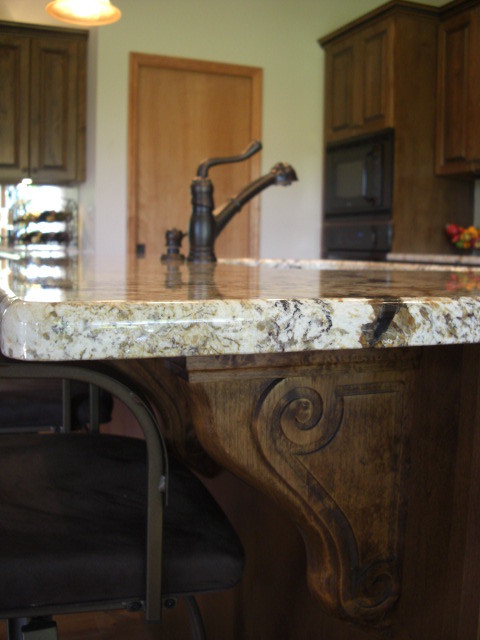 Exotic Granite wtih Dark Traditional Cabinets - Mediterranean - Kitchen ...