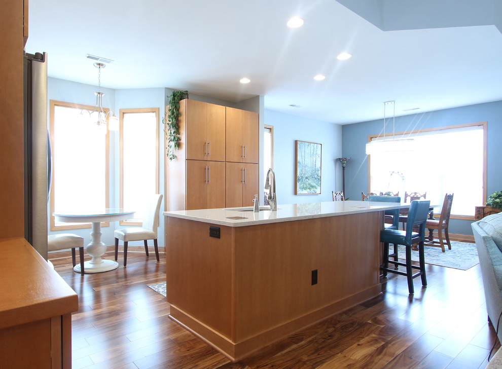 Flat Natural Maple Cabinets in Open Kitchen with Glass Backsplash ...