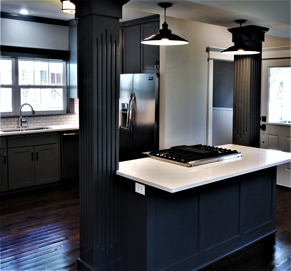 Fluted Pilasters Flank the Kitchen Island - Craftsman - Kitchen ...